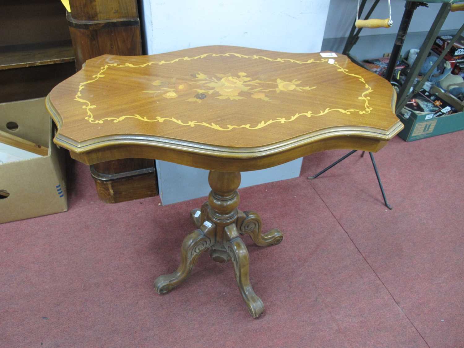 Lot 1548 - A coffee table on scroll feet with inlay