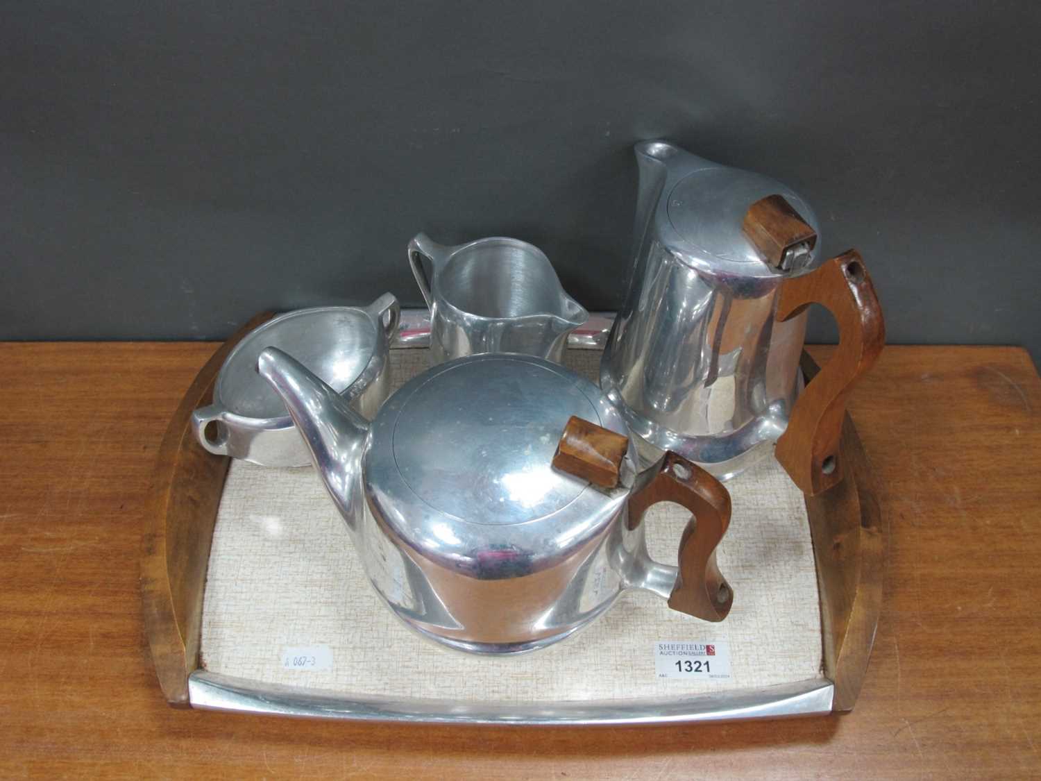 Lot 1321 - A Picquot Four Piece Tea Set, on a matching