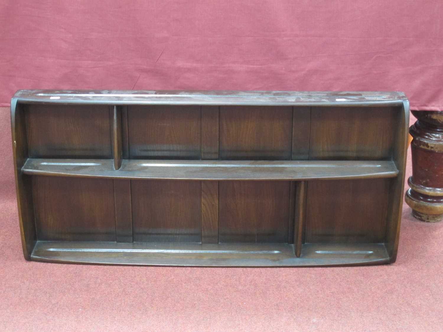 Lot 1471 - Ercol Wall Display Rack, with random