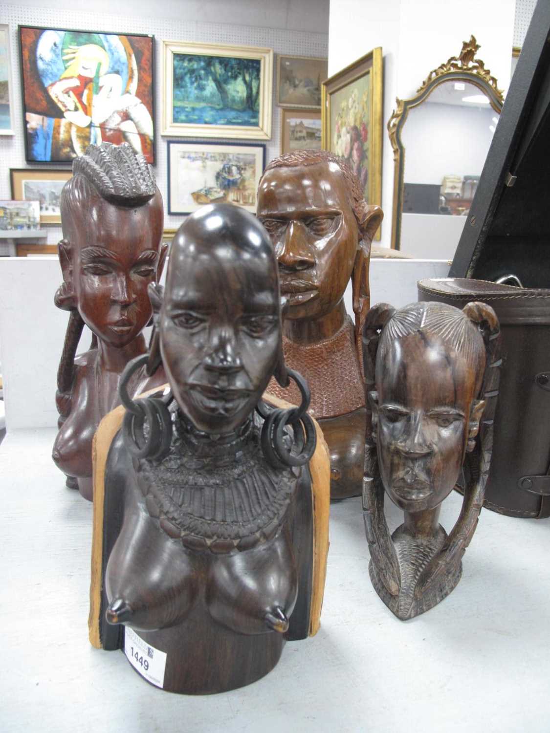 Lot 1449 - Carved wooden African busts of female form,