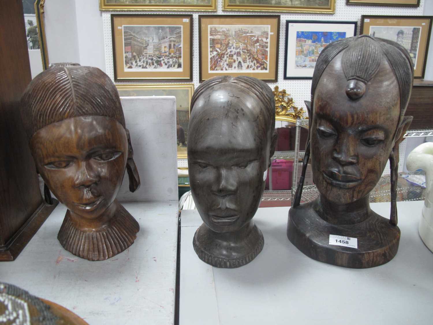 Lot 1458 - Carved wooden African busts of female form,