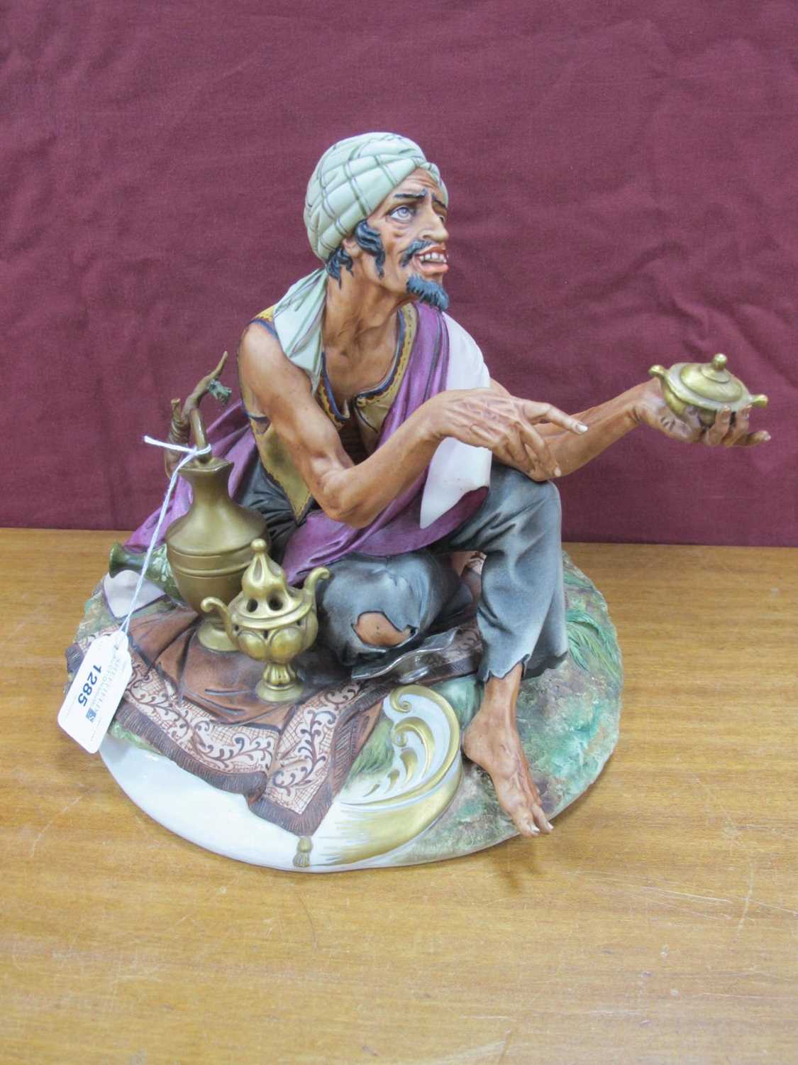 Lot 1285 - Capodimonte Figure of Seated Aladdin, 22cm