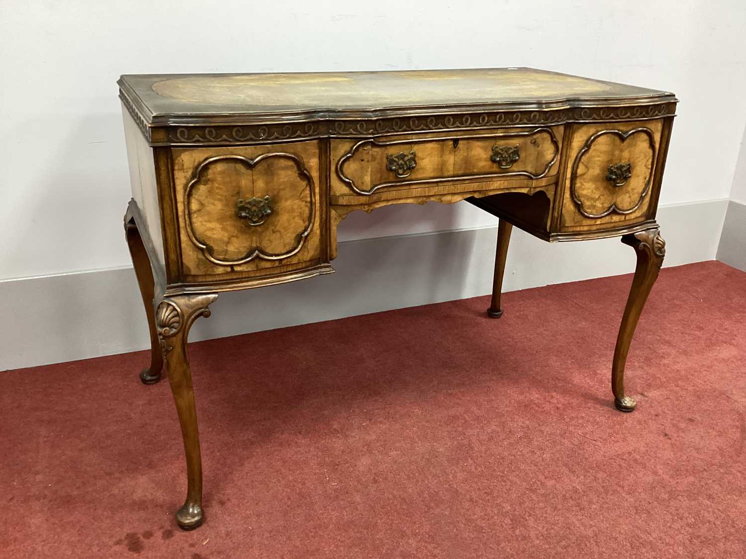 Lot 1509 - A XX Century Walnut Serpentine Shaped