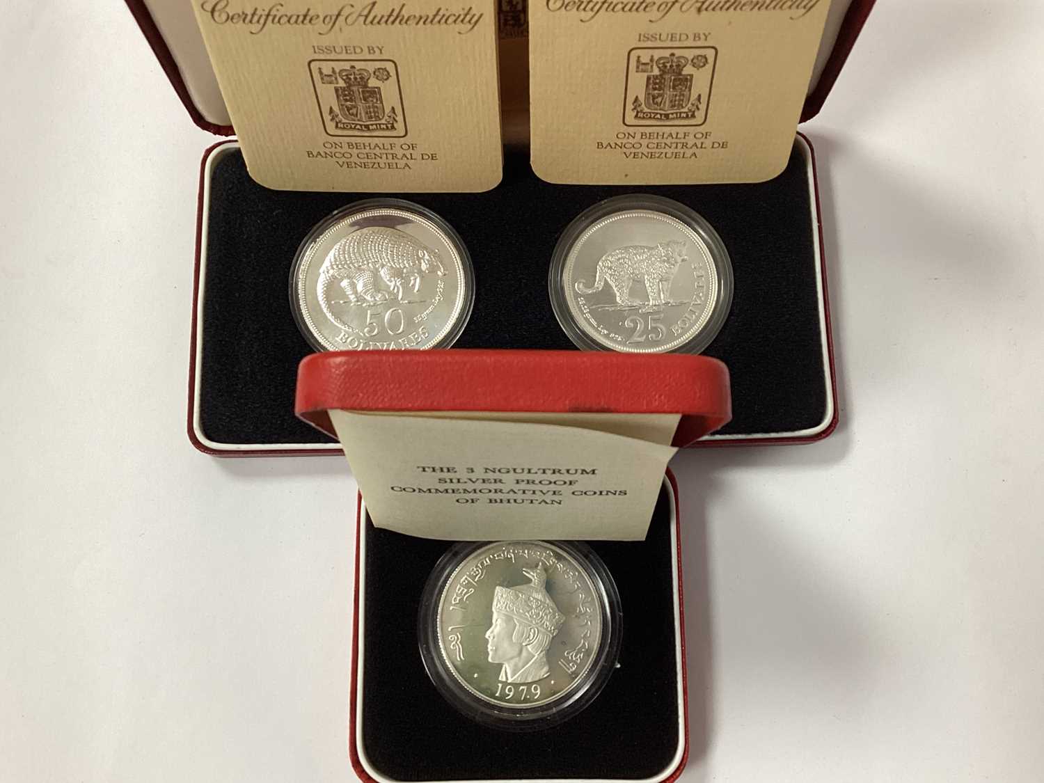 Lot 556 - Three Royal Mint Silver Proof Coins,