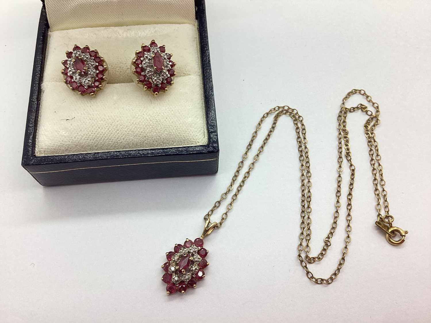 Lot 83 - A 9ct Gold Ruby and Diamond Set Pendant, of
