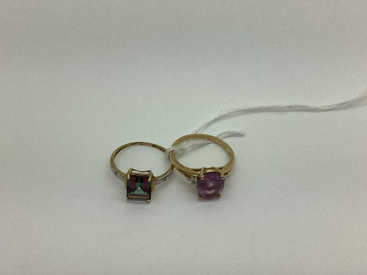 Lot 527 - Two Modern Single Stone Dress Rings, each