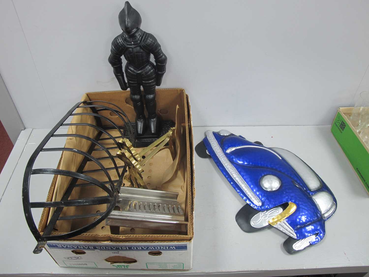 Lot 1052 - Iron Knight, 51cm tall, posy wall rack,