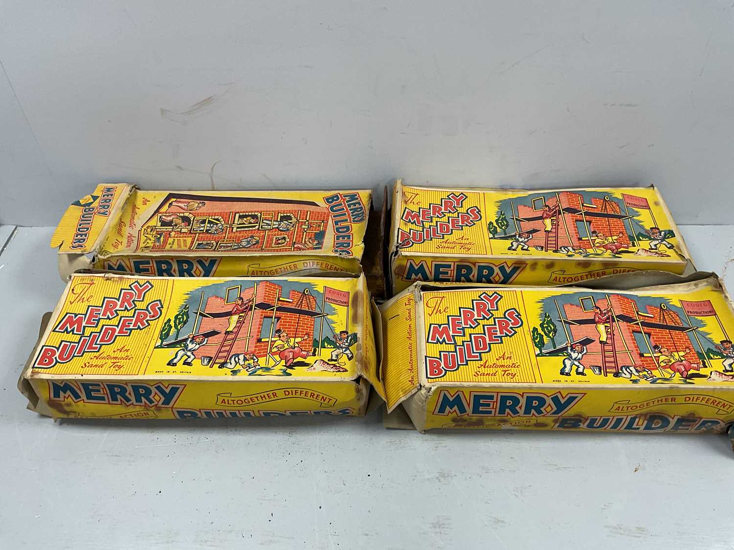Lot 1082 - Codeg Tin Plate Merry Builders Toy, in