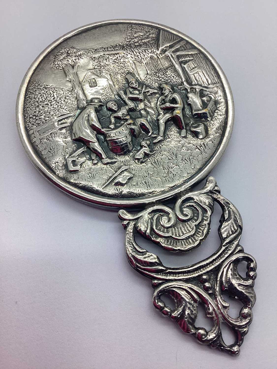 Lot 56 - A Dutch Hand Mirror, detailed in relief with
