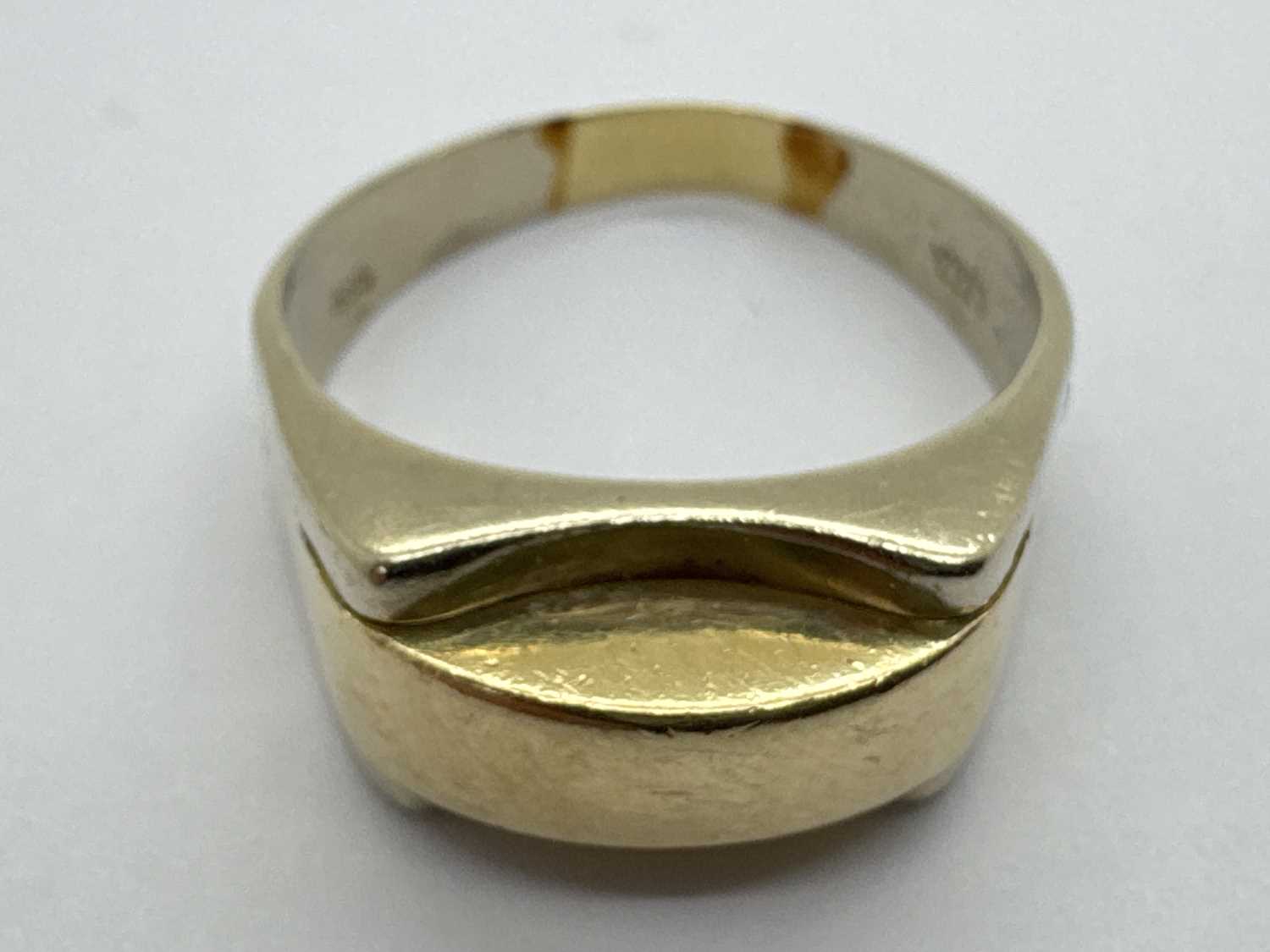 Lot 21 - A Modernist Style Two-Tone Gent's Ring, the