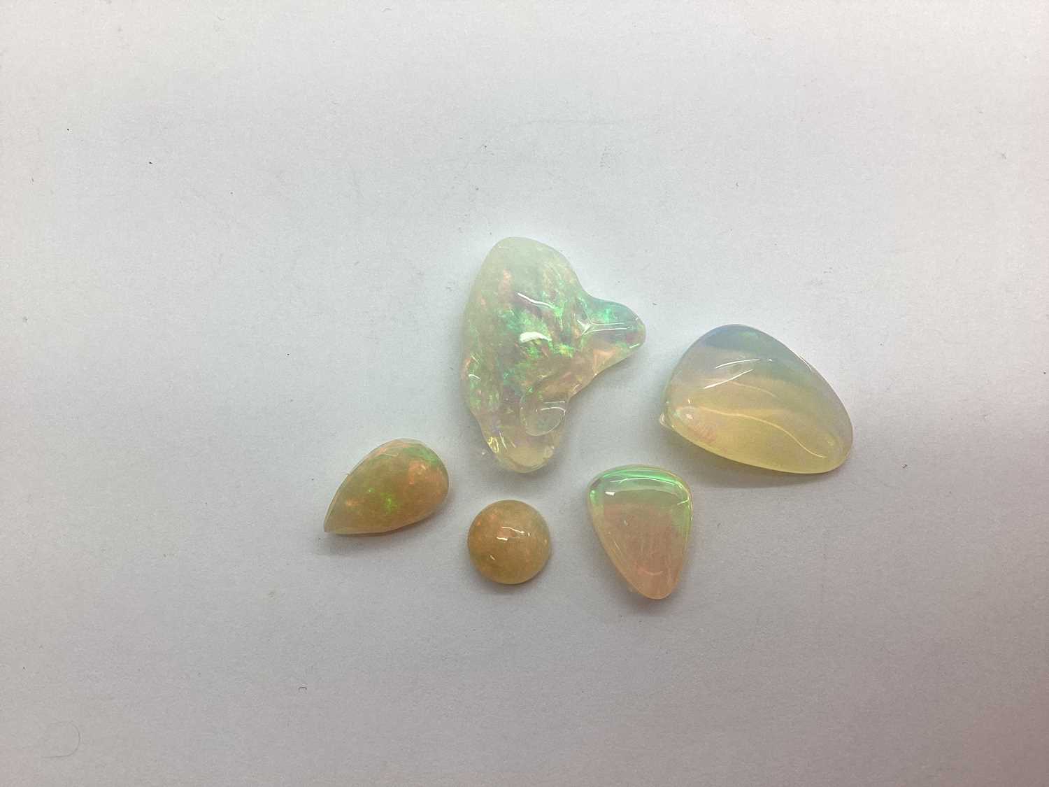 Lot 215 - Five Unmounted Polished Opals, irregular,