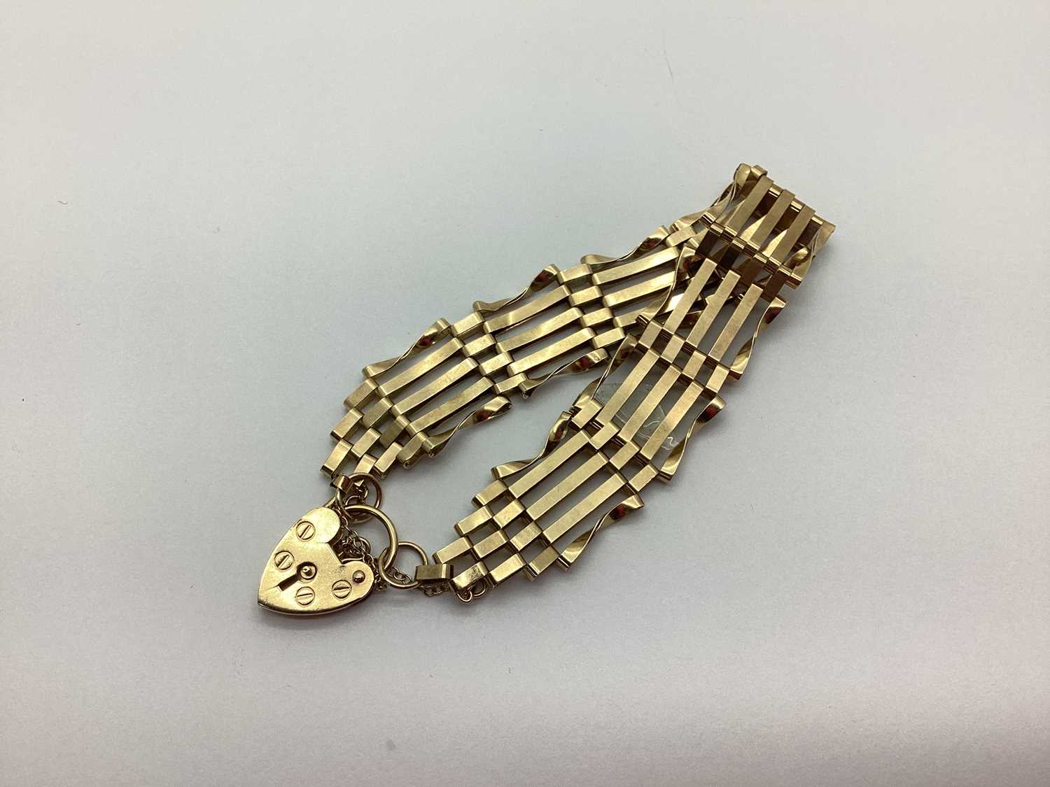 Lot 216 - A 9ct Gold Gate Link Bracelet of Panel